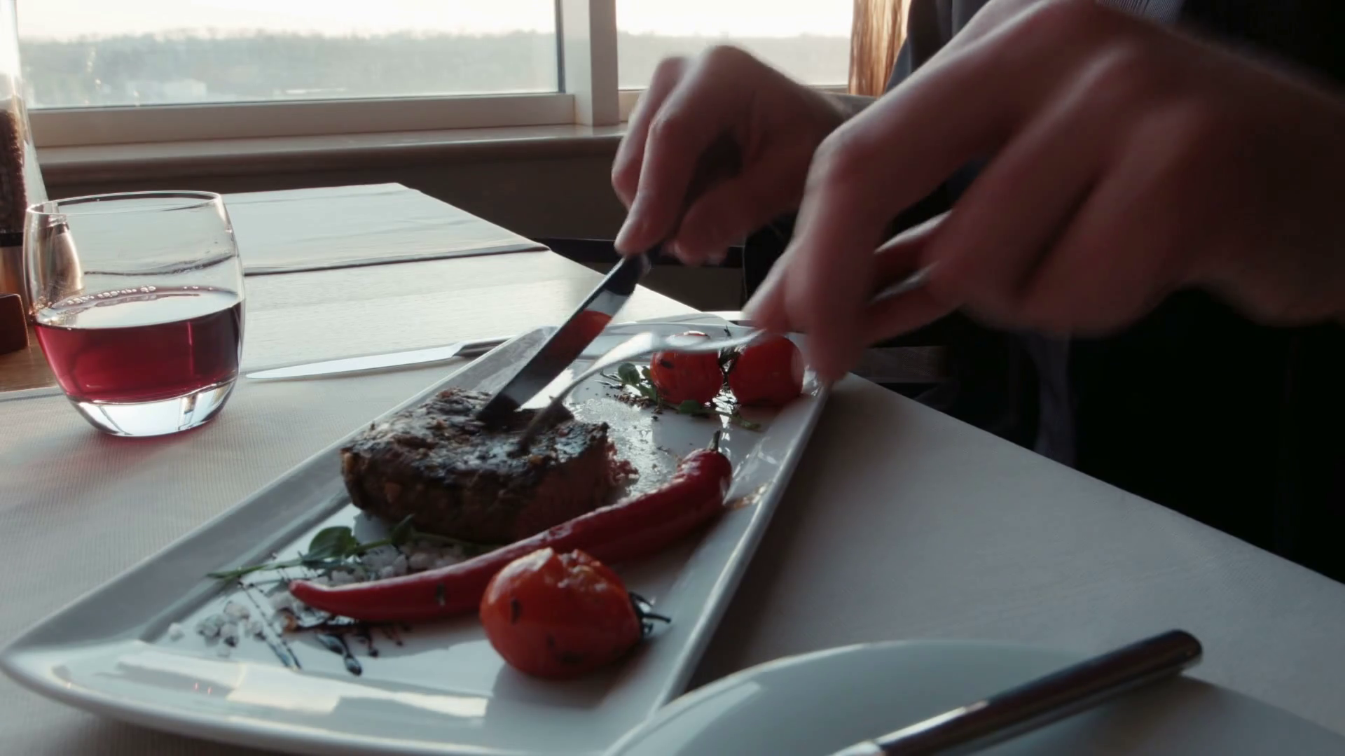 The Man With Knife Cuts Steak On Plate Stock Footage SBV-306153006 ...