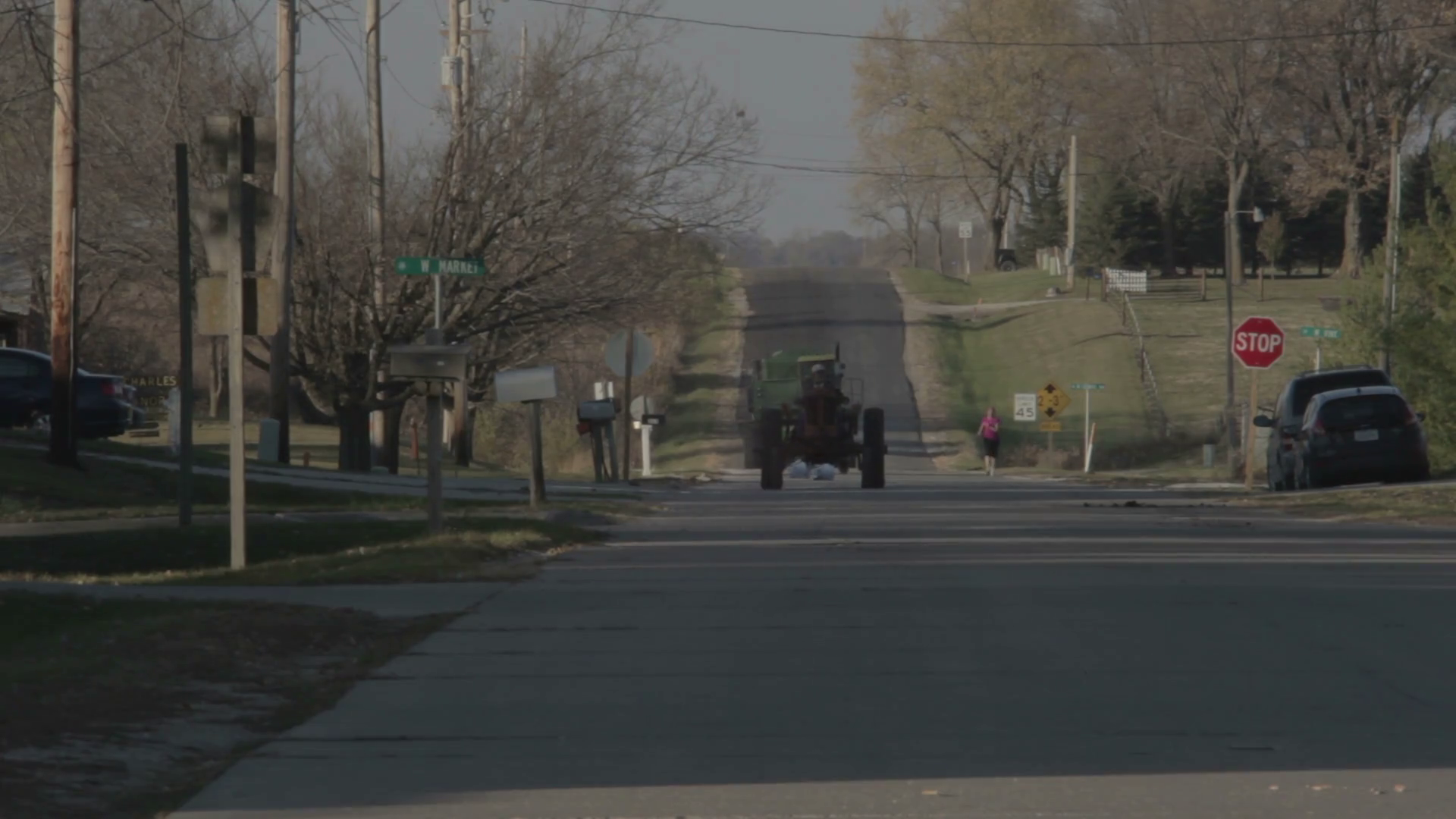 Tractor Driving On Rural Neighbordhood Road Stock Footage SBV-300095038 ...
