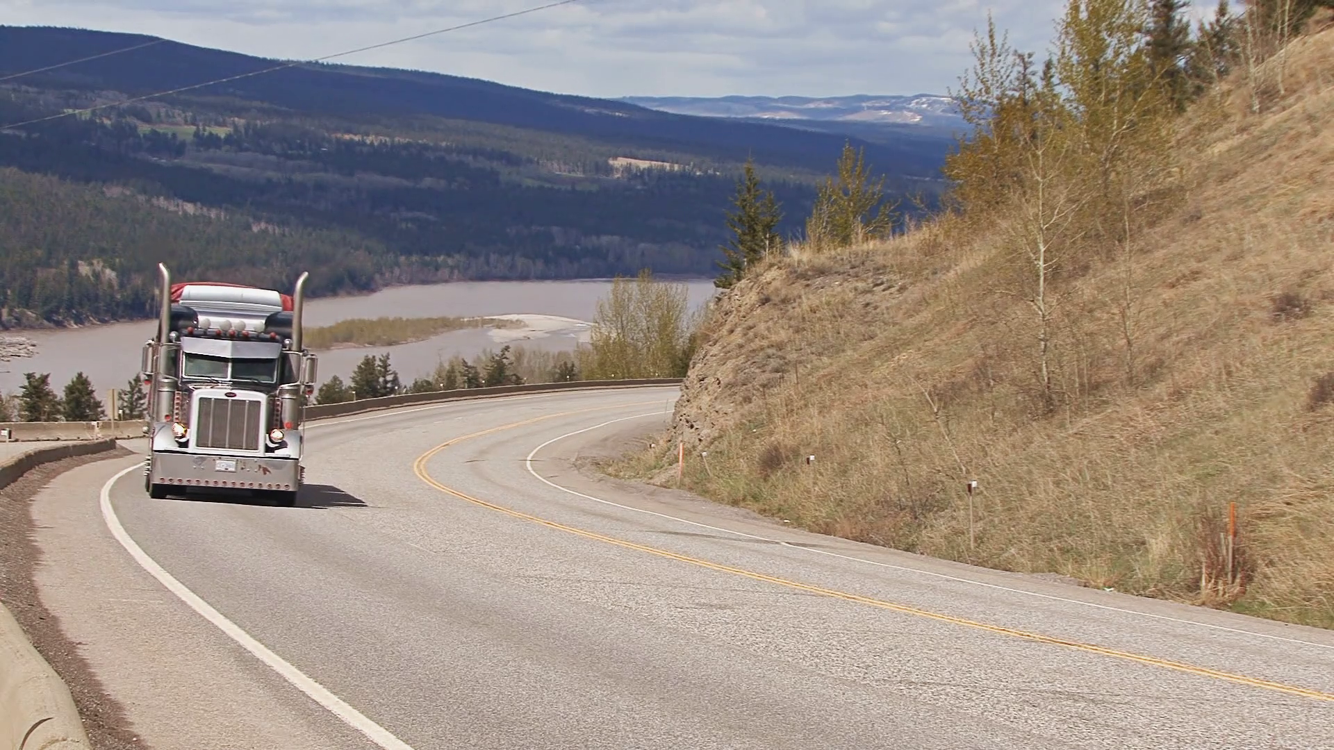 Truck Hauling Heavy Load Uphill In Canada Stock Footage SBV-300129503 ...