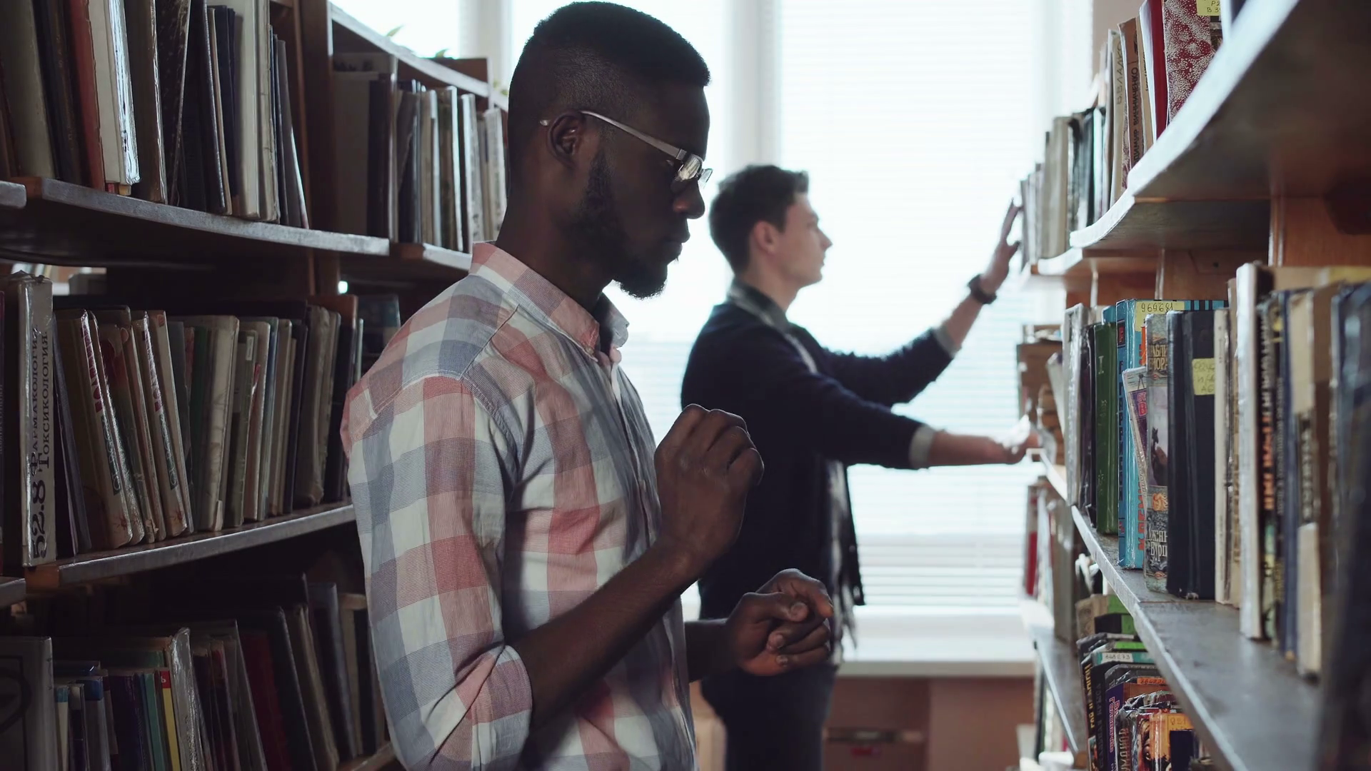 Two Students Searching Literature In Library Stock Footage SBV ...