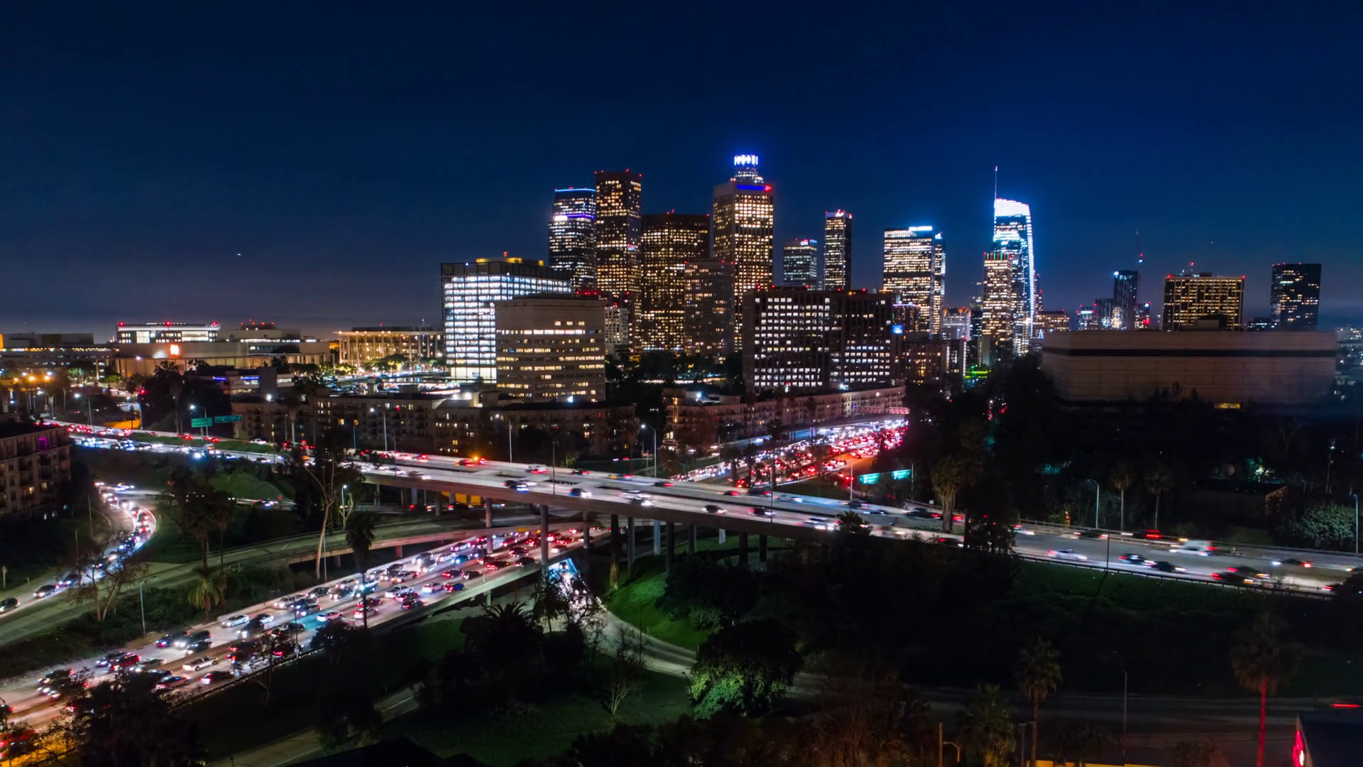 Cinematic urban aerial hyperlapse of downtown Los Angeles freeways with ...