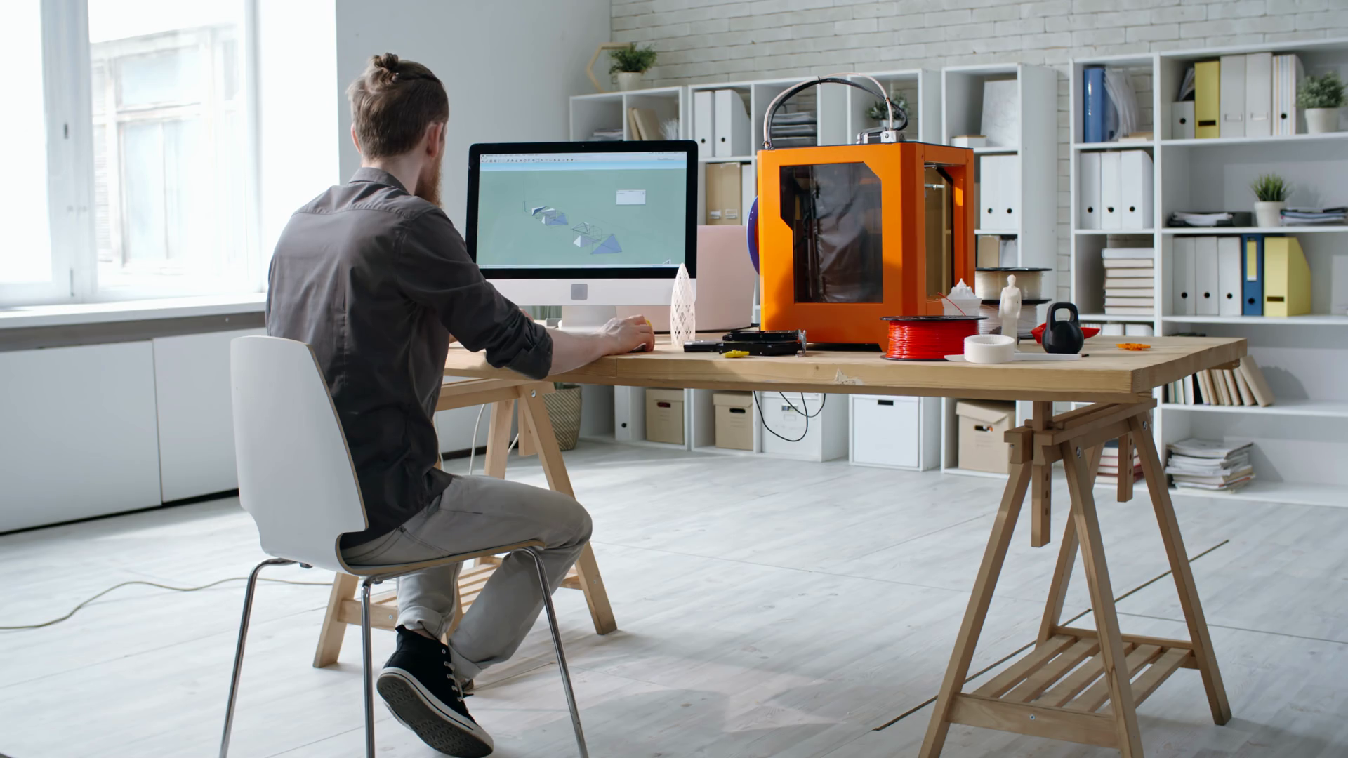 Rear View Of Male Designer Sitting At Desk Stock Footage SBV-320522405 ...