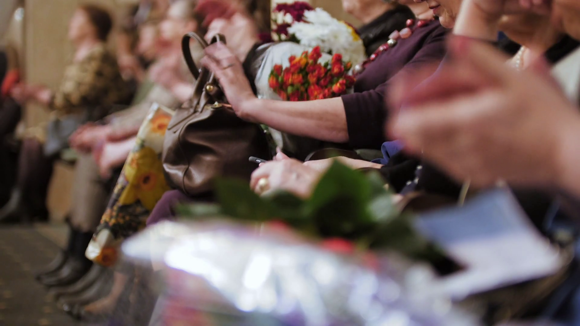 Spectators in the Theater hall applauding the performance on stage ...