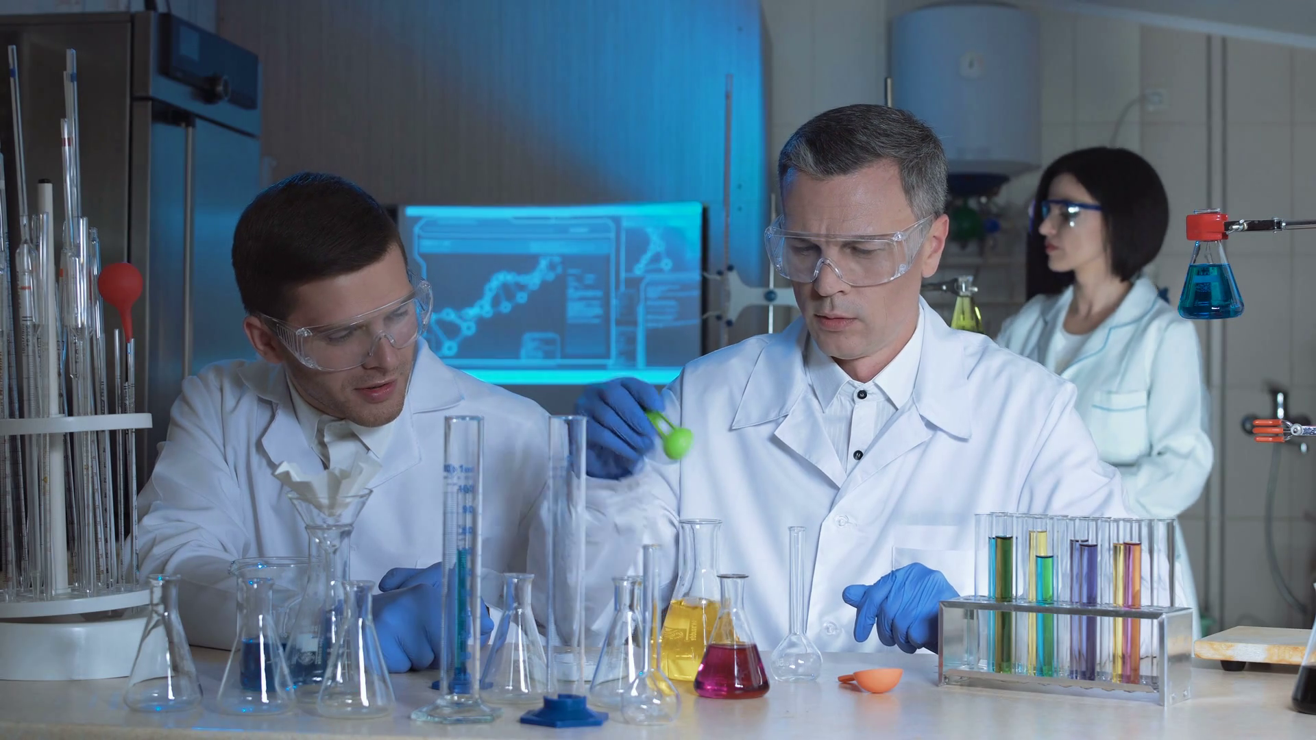 Technologists or scientist working in a chemical laboratory doing ... Technologists or scientist working in a chemical laboratory doing ...