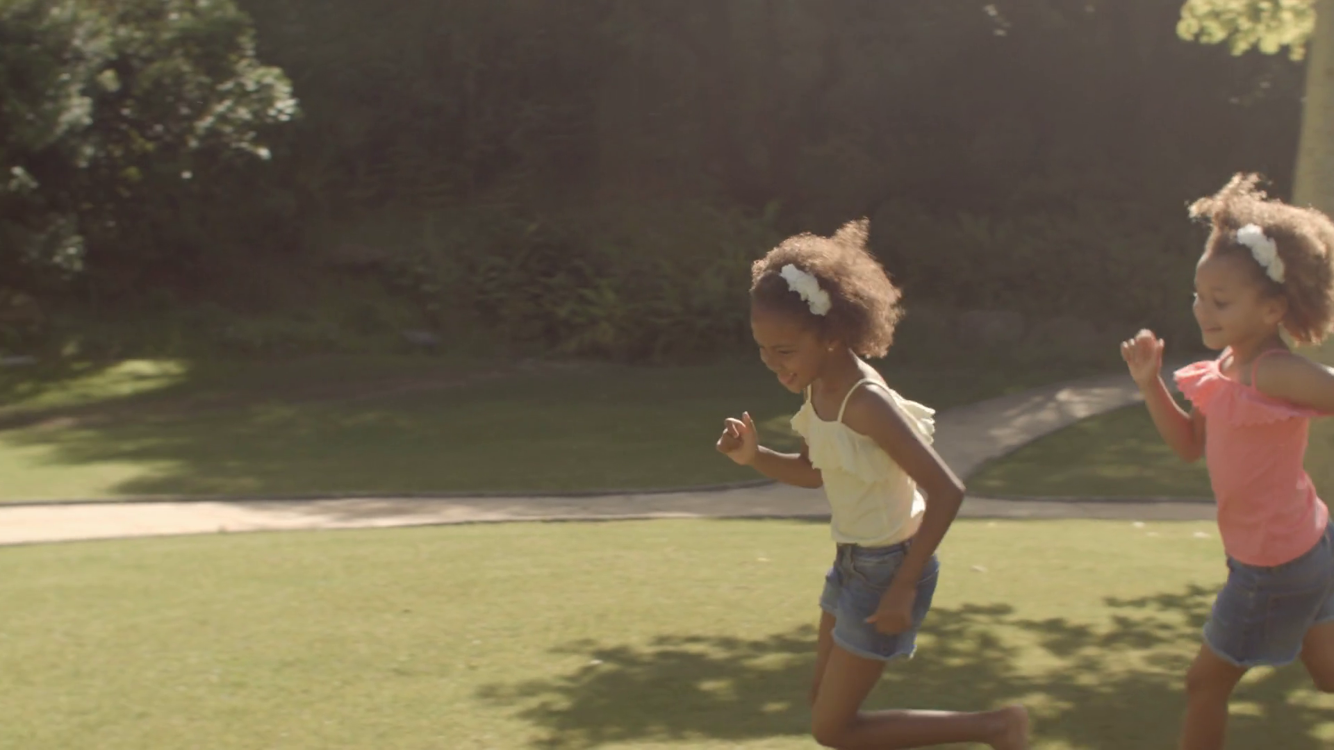 Two Children Running Around Camera In Park Stock Footage SBV-316589558 ...