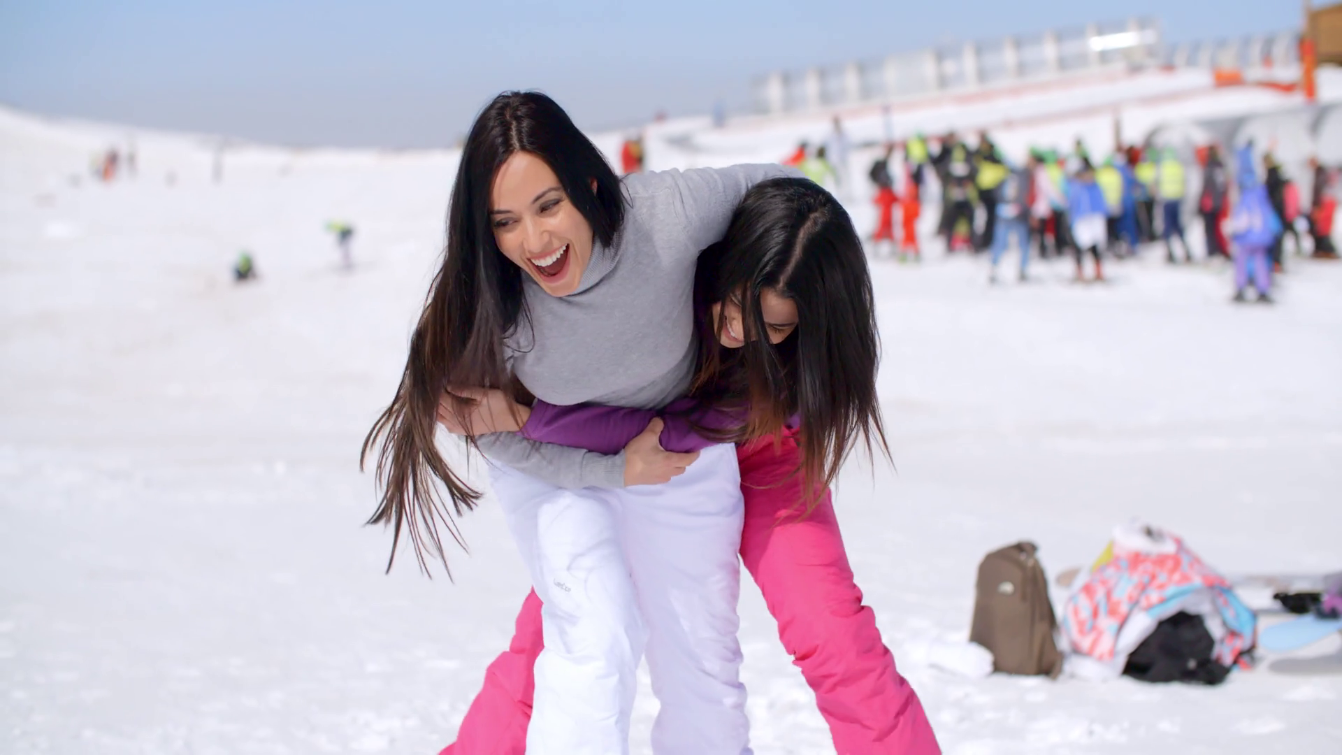 Two playful woman frolicking in the snow Stock Video Footage 00:13 SBV ...