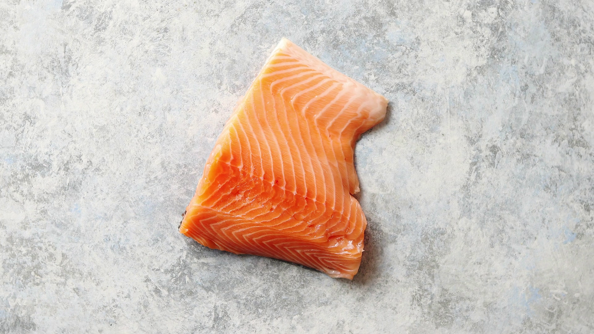 Raw fresh salmon meat placed on gray stone background. Top view ...