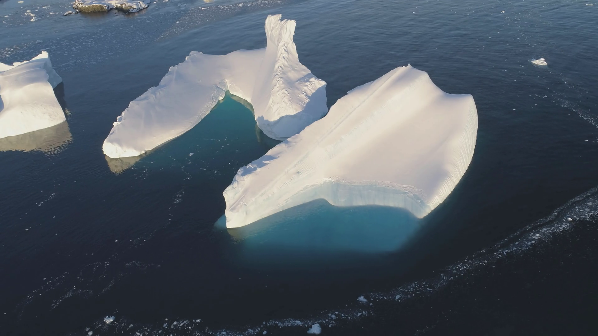 Iceberg Melt In Clear Ocean Drone Top Down Stock Footage SBV-348392018 ...