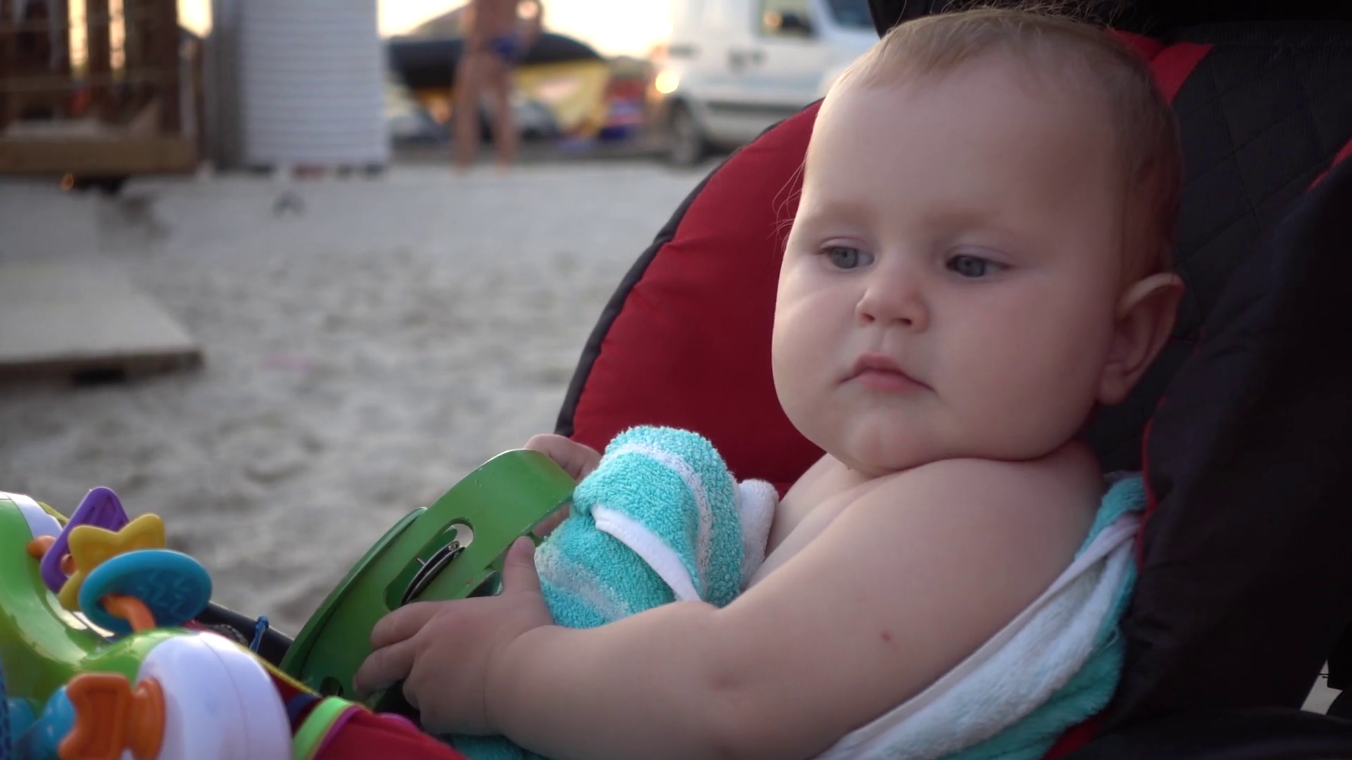 Baby girl playing rattle in her stroller - summer day Stock Video ...