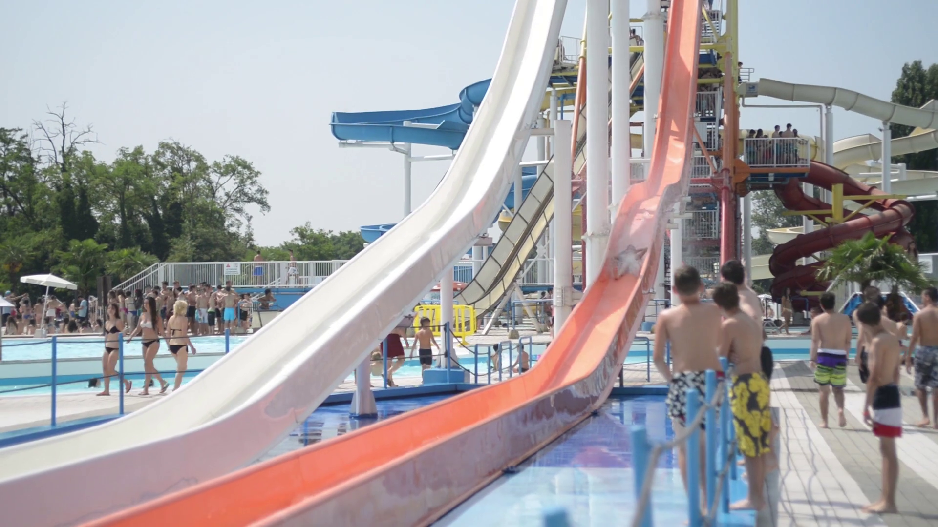 Children ride on the big slides in the water park Stock Video Footage ...