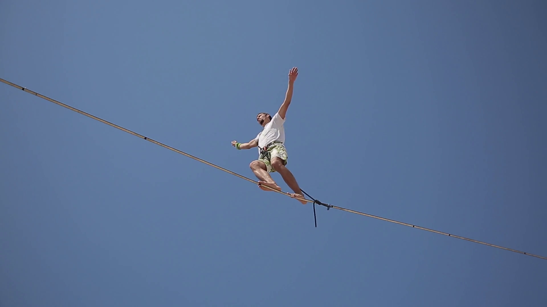 Man Stunt Walking On Tightrope Under Blue Sky Stock Footage SBV ...