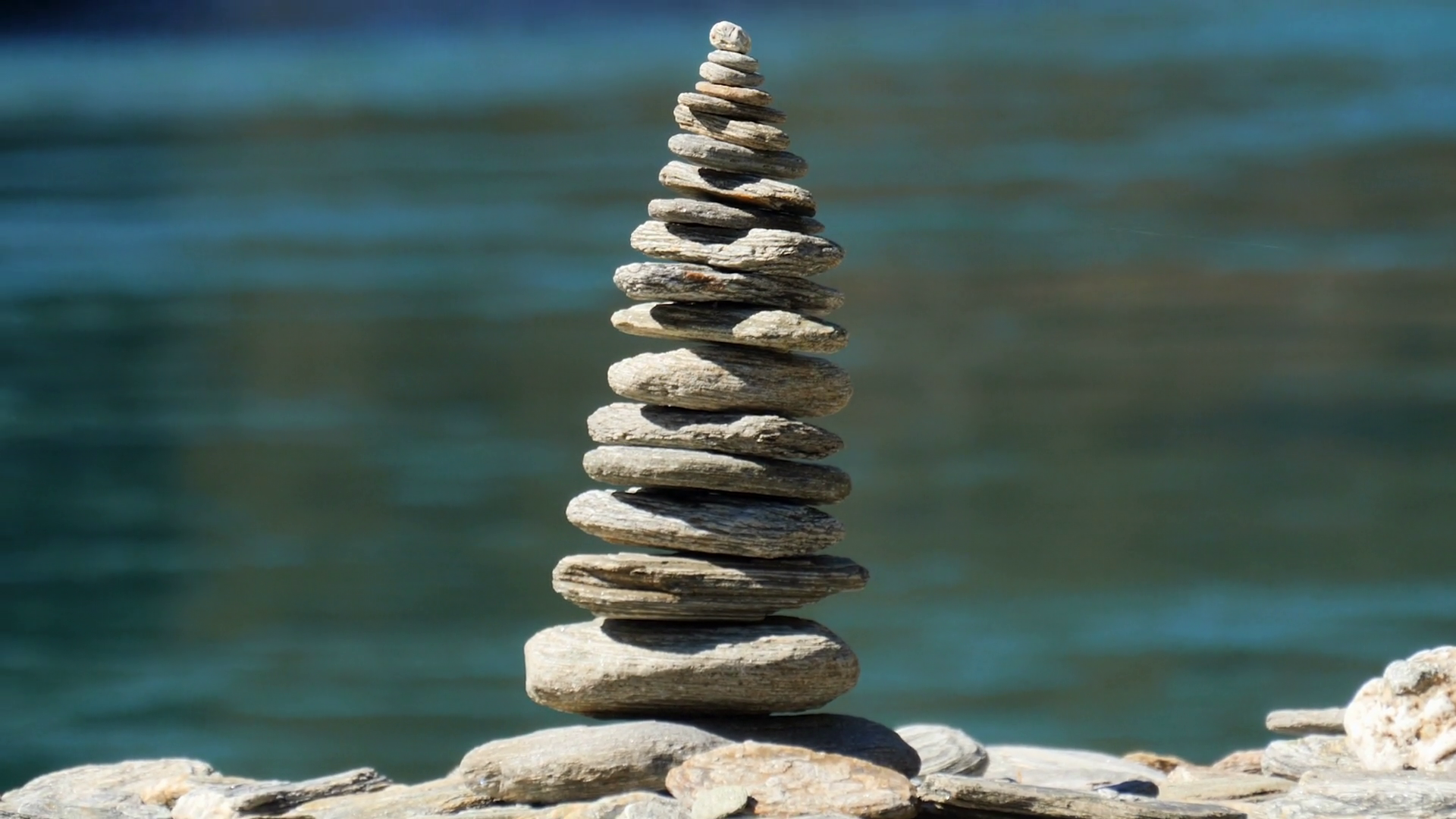 Stones Stacked Into Cairn Along Riverbank - Stock Footage SBV-349037799 ...