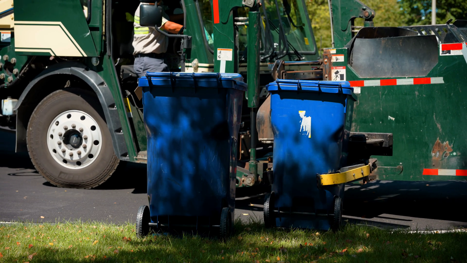 Garbage Truck Unloading Garbage Can At Sunny Stock Footage SBV ...