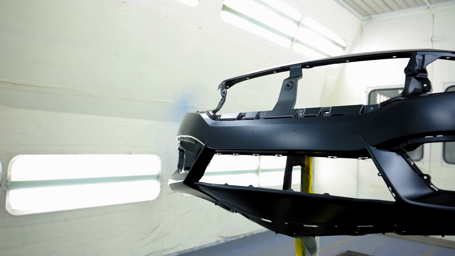 A Freshly Painted Car Bumper Mounted Inside Stock Footage SBV-353387670 ...