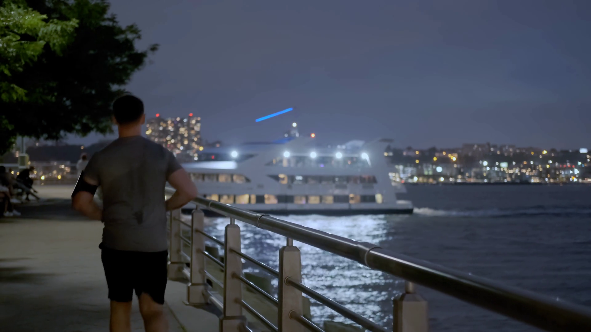 Young male sportsman is running on pier near a ship at night Stock ...