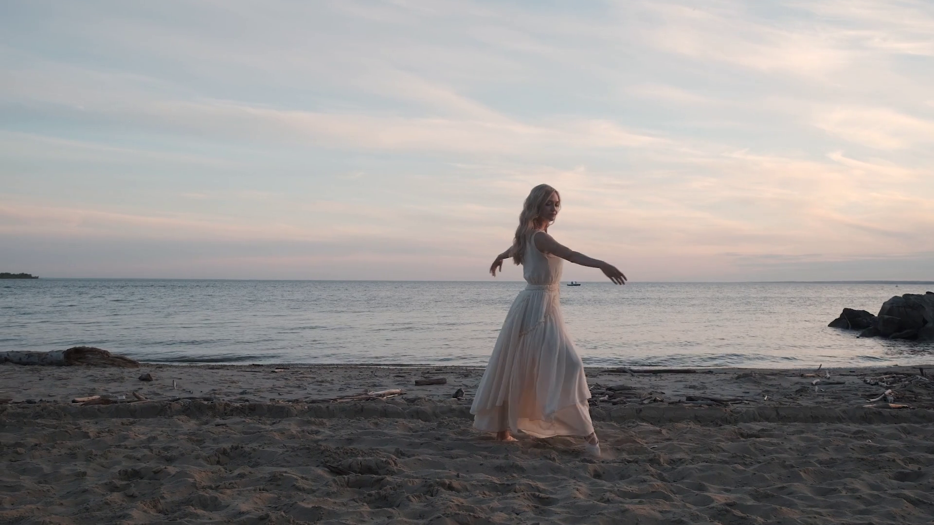 Girl In A Flowing Dress Dancing By The Sea At Sunset Stock Video