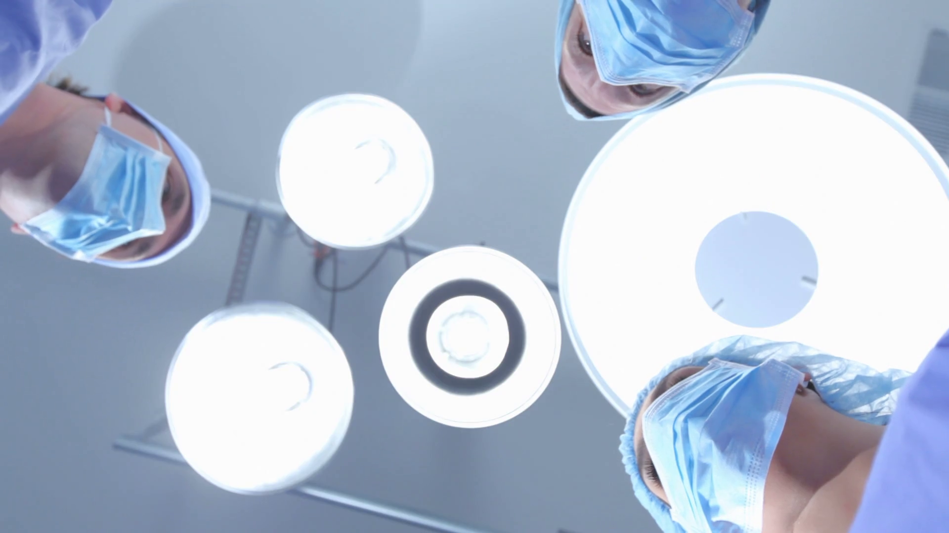 Group Of Surgeons Look Down At Patient Stock Footage SBV-348367665 ...