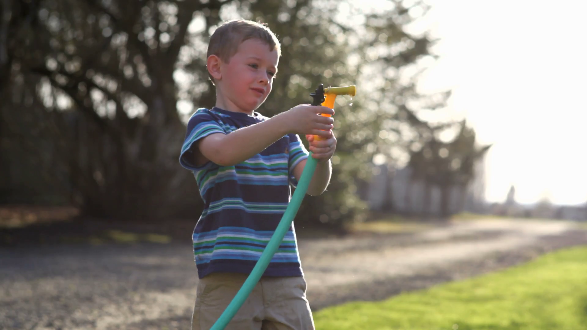 Young Boy Spraying Hose Stock Footage SBV-348367694 - Storyblocks