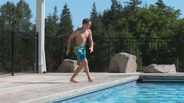 Young Boy Walking Out Of Pool Stock Footage: Royalty-Free Video Clips ...