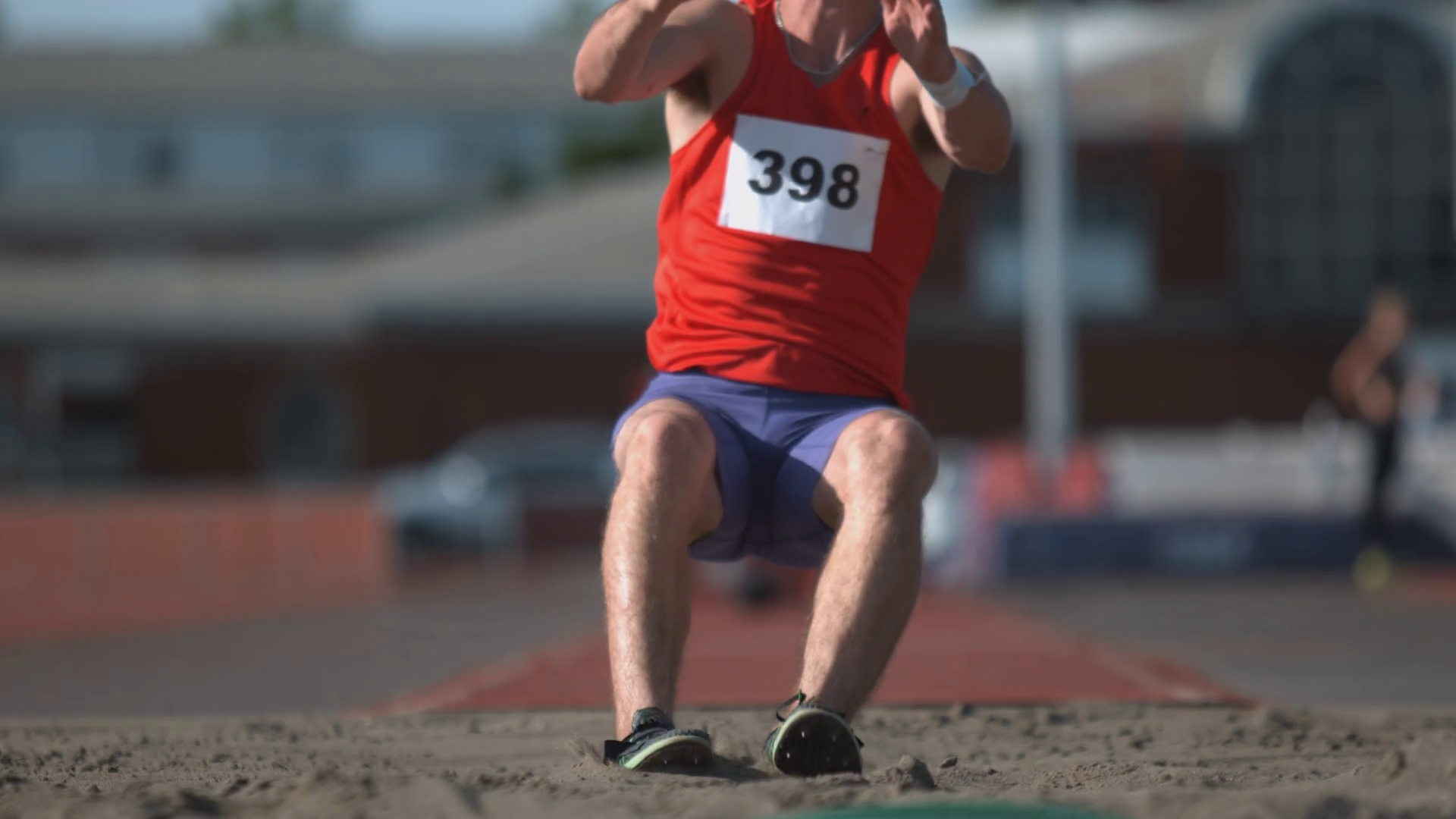 Track Athlete Landing In Sand On Long Jump Stock Footage SBV-347626101 ...