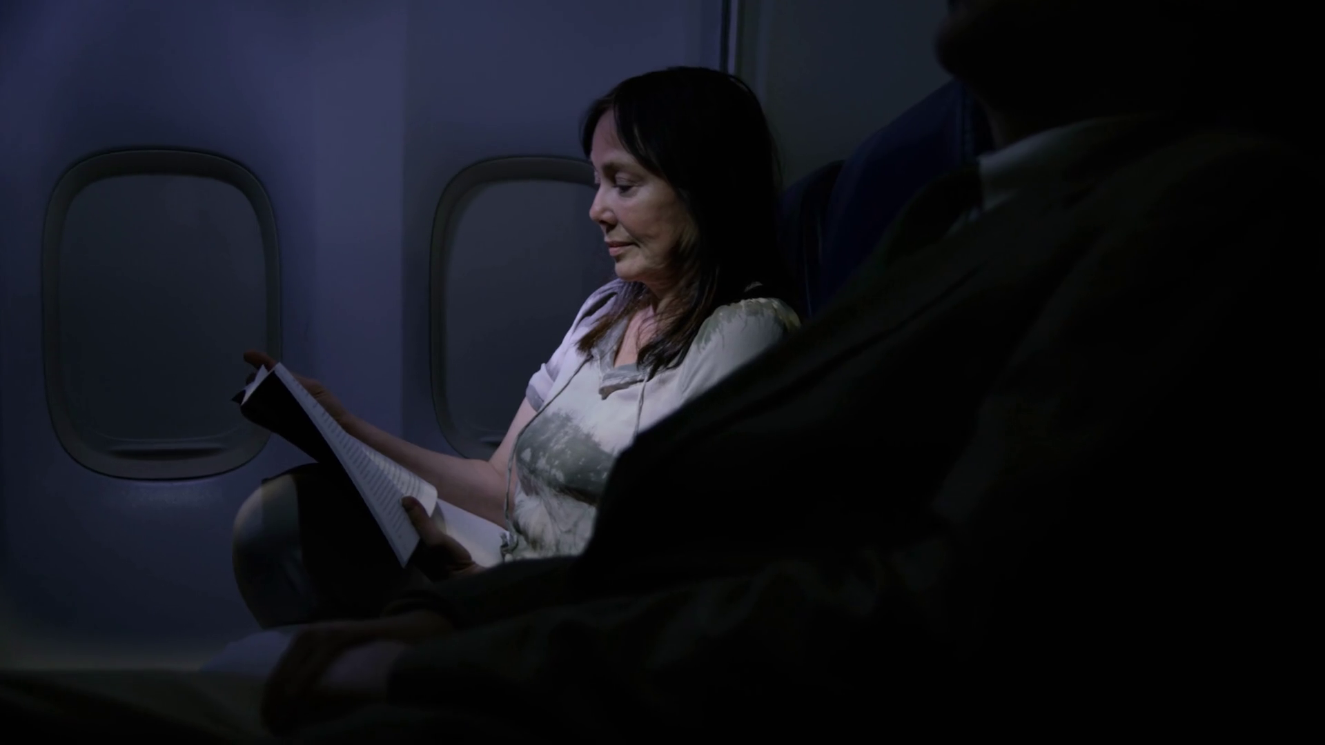 Woman Reading At Night On Airplane Flight Stock Footage SBV-347630458 ...