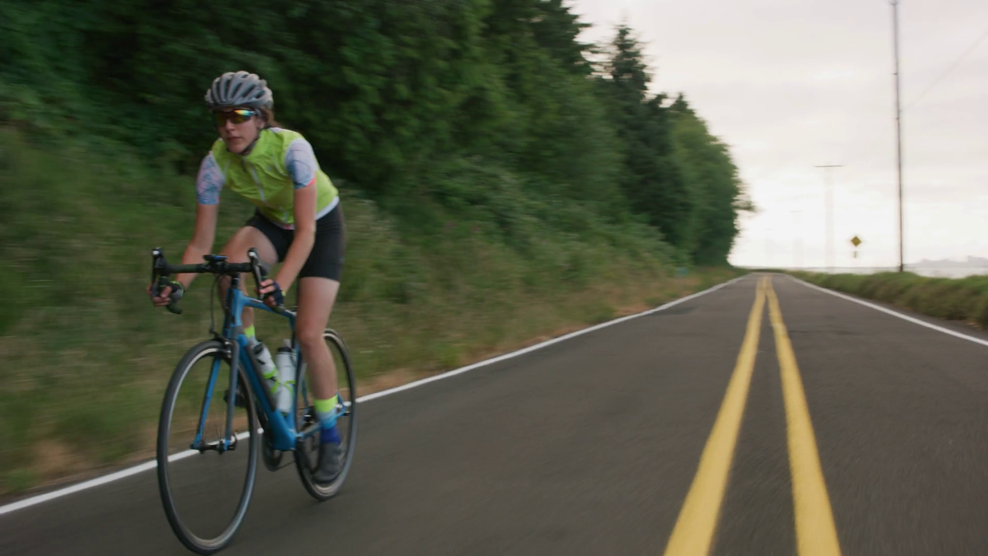 Tracking Shot Of Female Cyclist On Country Stock Footage SBV-347673886 ...