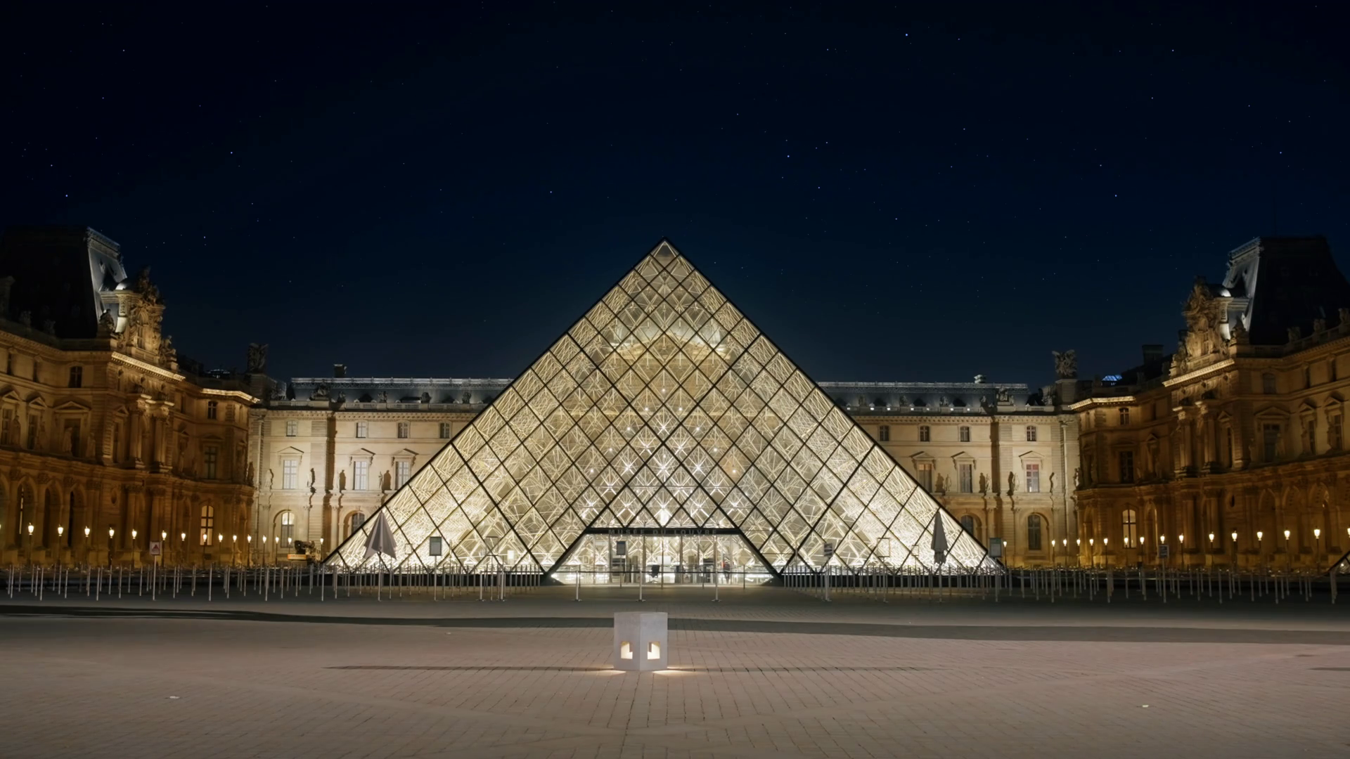 The Le Louvre Pyramid Lights Up Night Sky In Stock Footage SBV ...