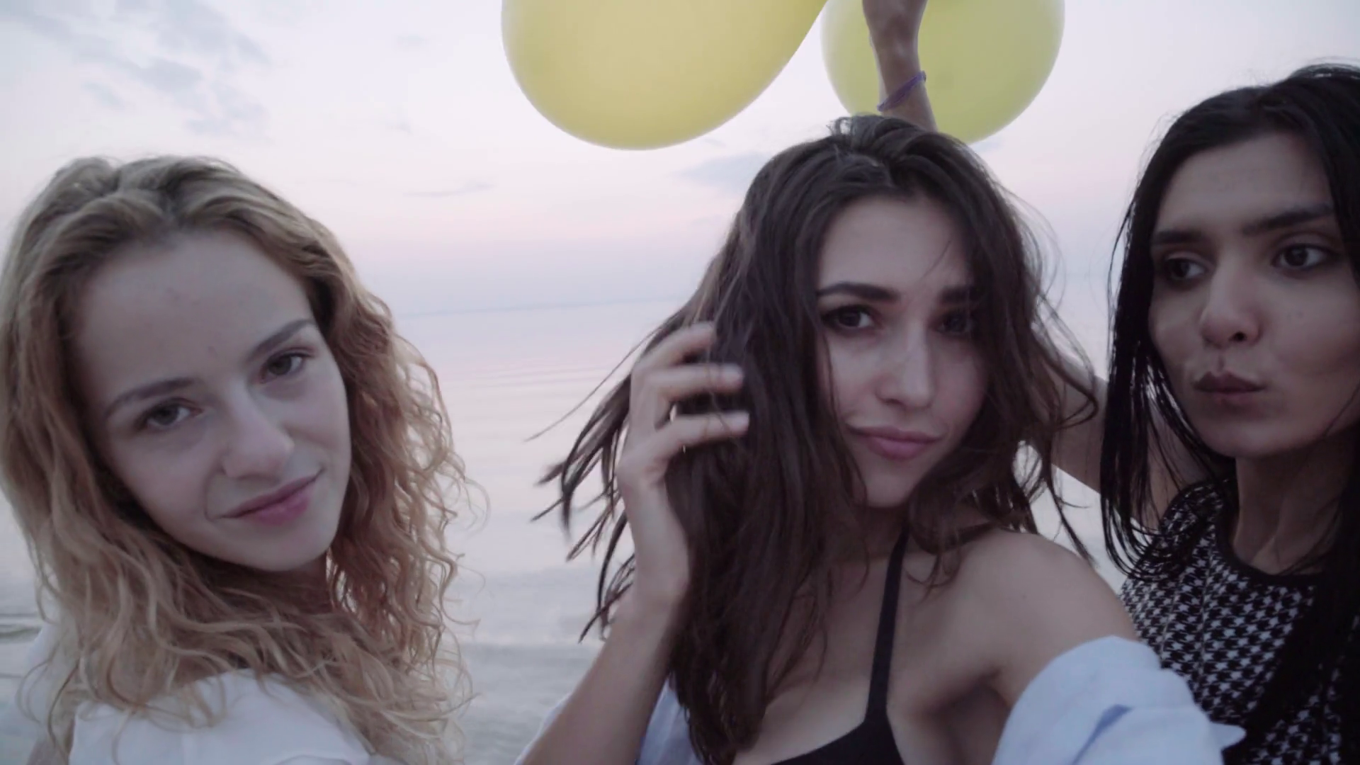 Three Beautiful Young Mixed Race Girls Or Women Making Selfie At Sunset