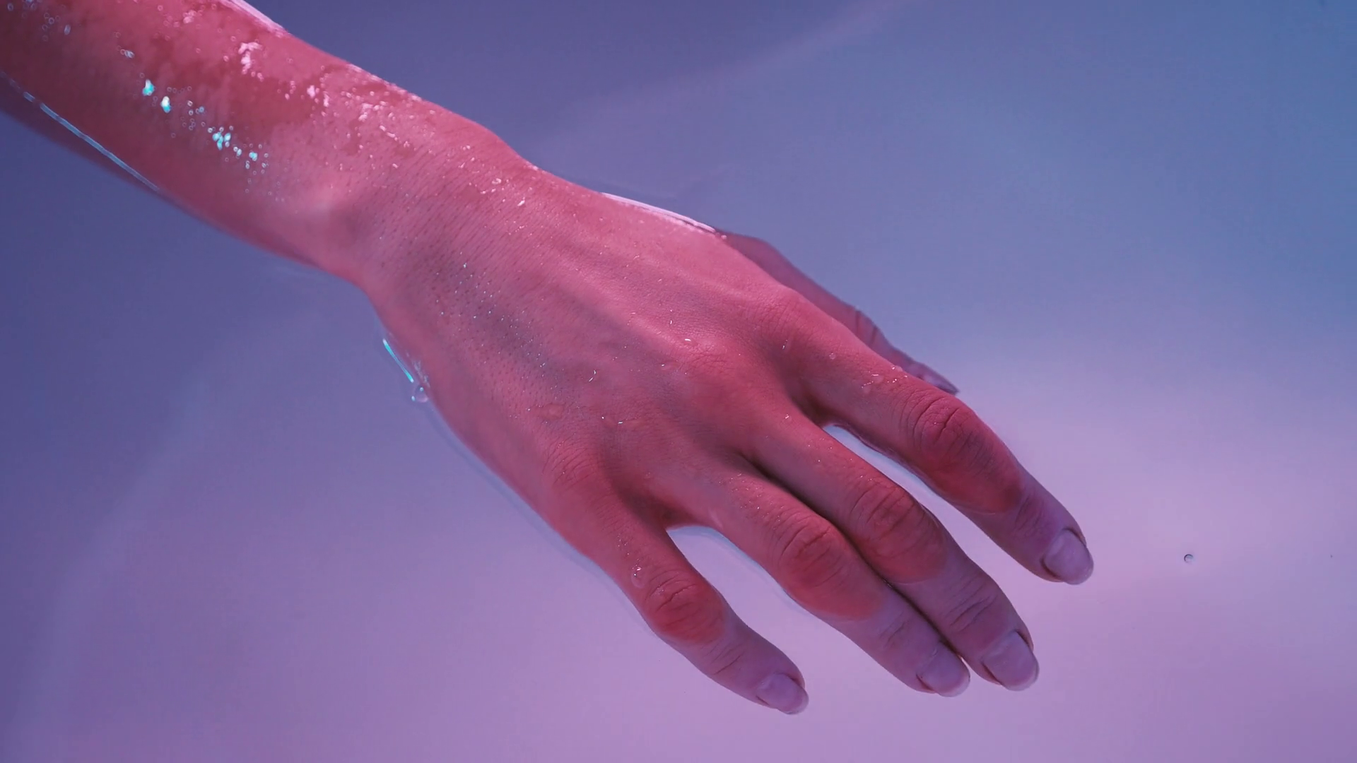 Young womans hand floating in Spa bath or swimming pool, she is very ...