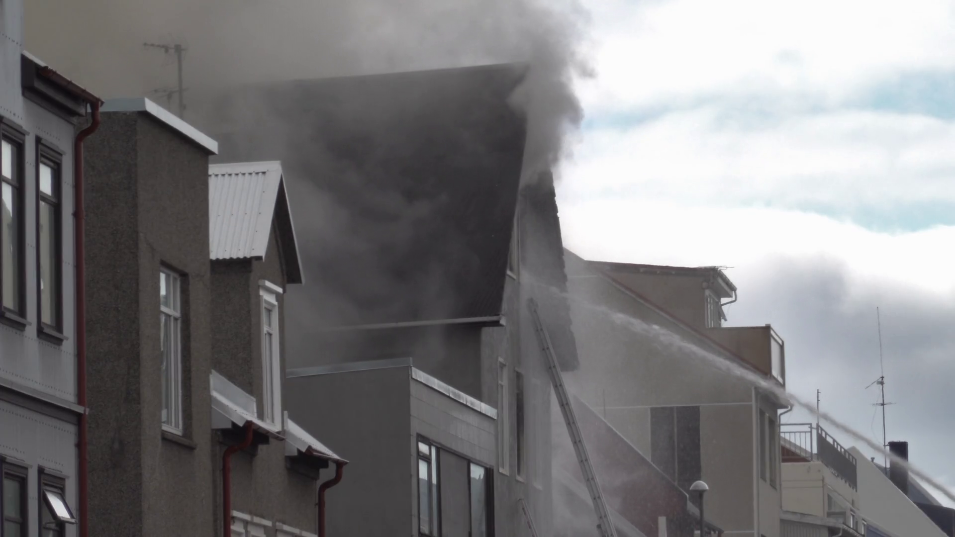 Firefighter On Roof Putting Out House Fire Stock Footage SBV-348366194 ...