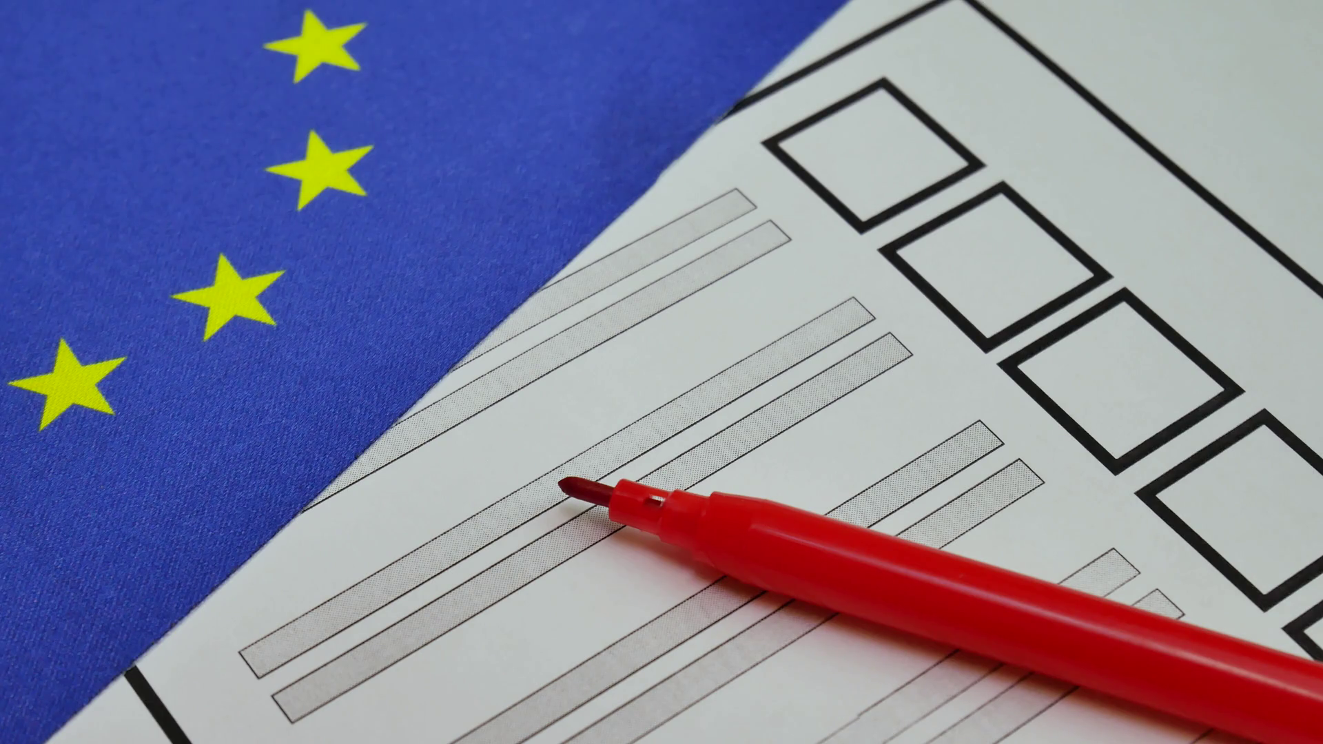 Voting in paper ballot by red pencil in European Union wirh EU flag ...