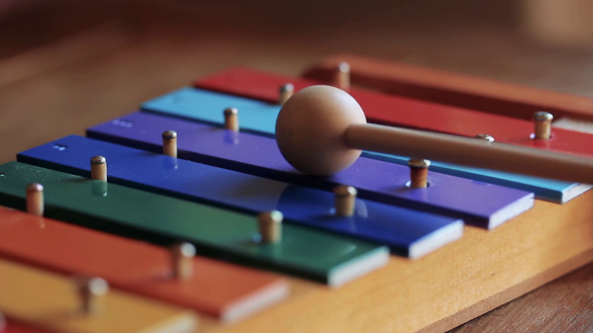 Close-up Of Mallet Hitting Colorful Wooden Stock Footage SBV-352017083 ...