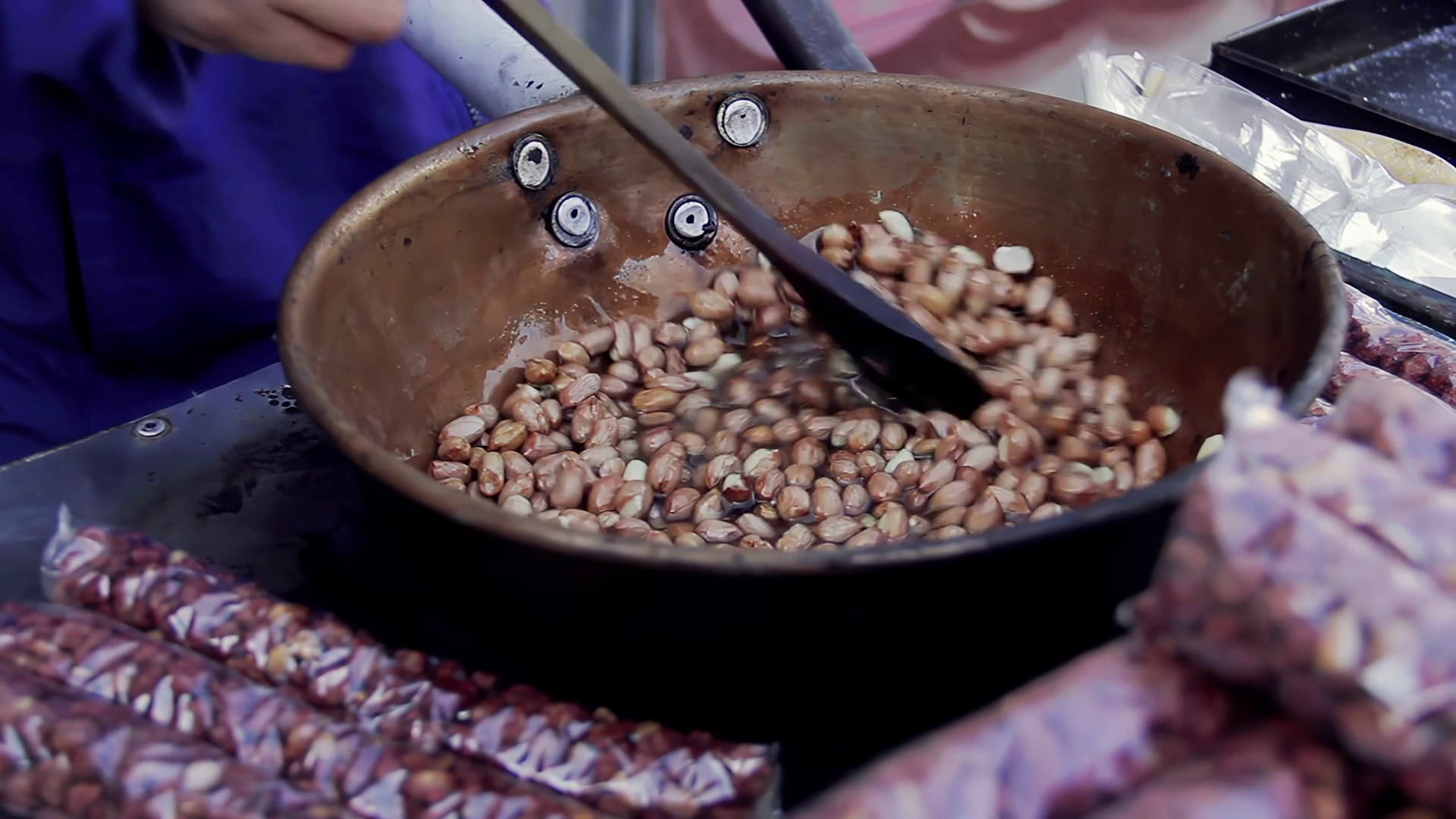 Street Vendor Stirring Caramelized Peanuts Stock Footage SBV-352730835 ...