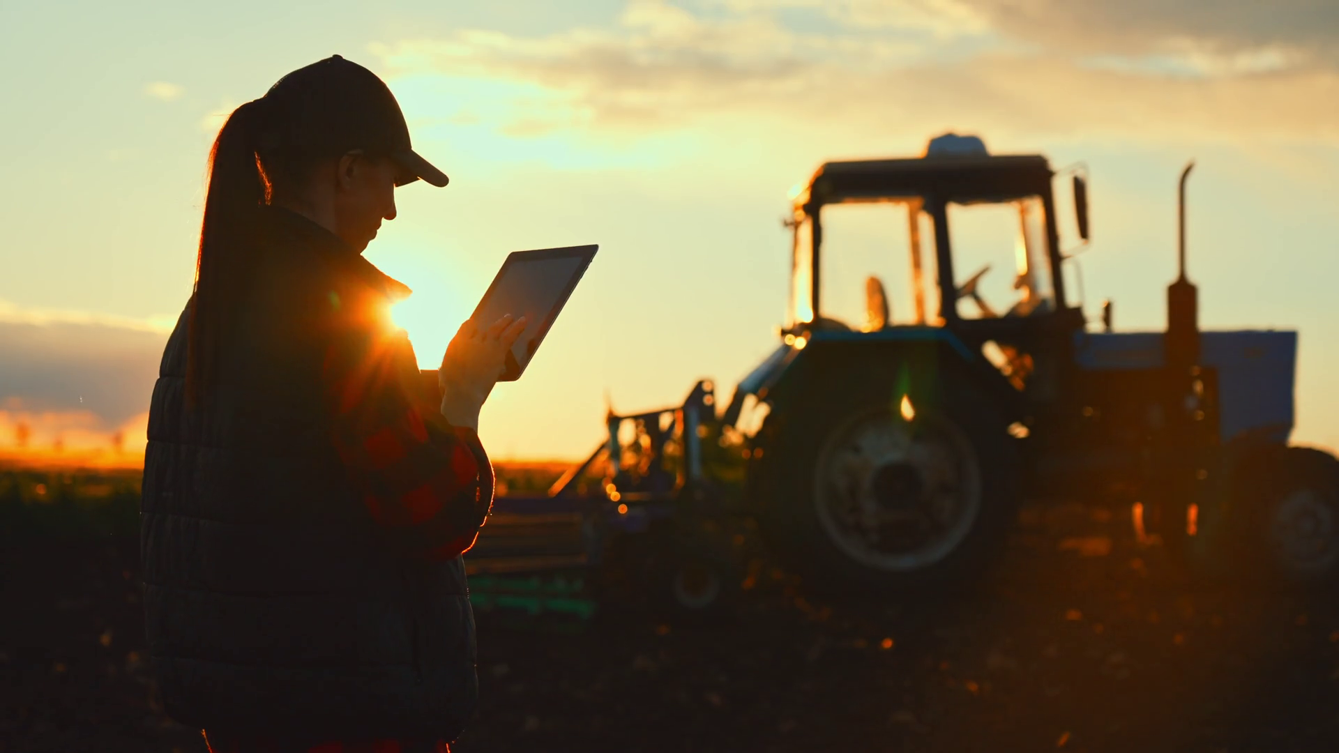 Farmer woman with tablet working in field. Concept of technology in ...