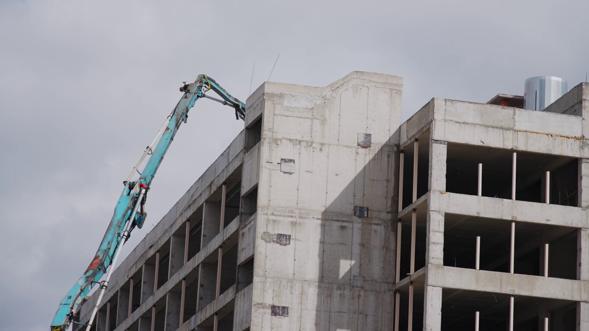 Process of building residential building with crane on background of ...