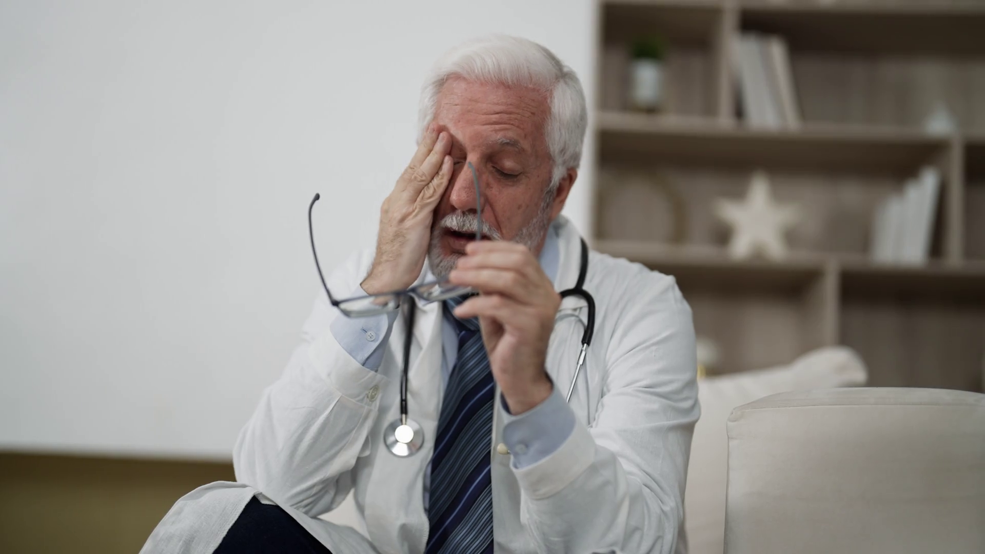 Tired Man Doctor Rubs Face In Hospital Stock Footage SBV-348842391 ...