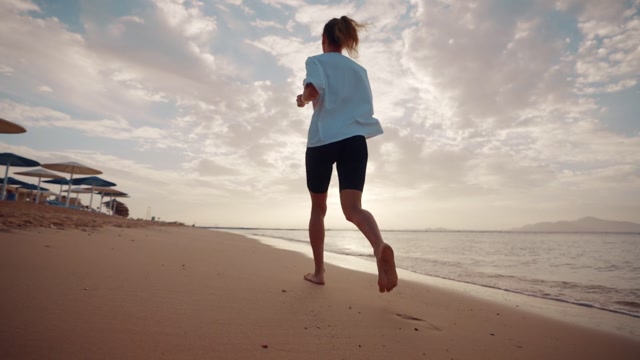 Woman Running Into Sunset Stock Footage: Royalty-Free Video Clips ...