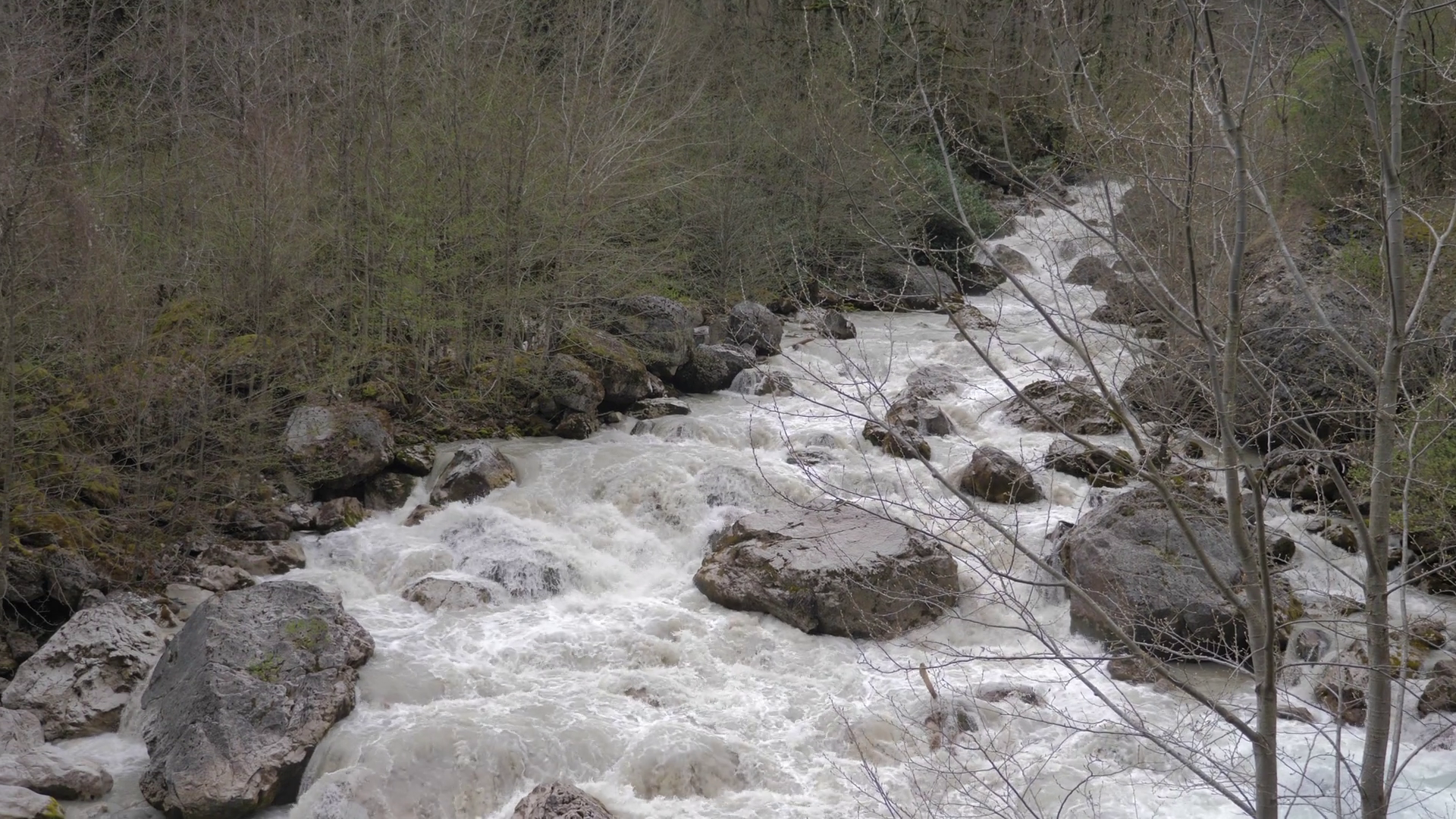 Fast water stream in mountain river with stones. Fresh cold water ...