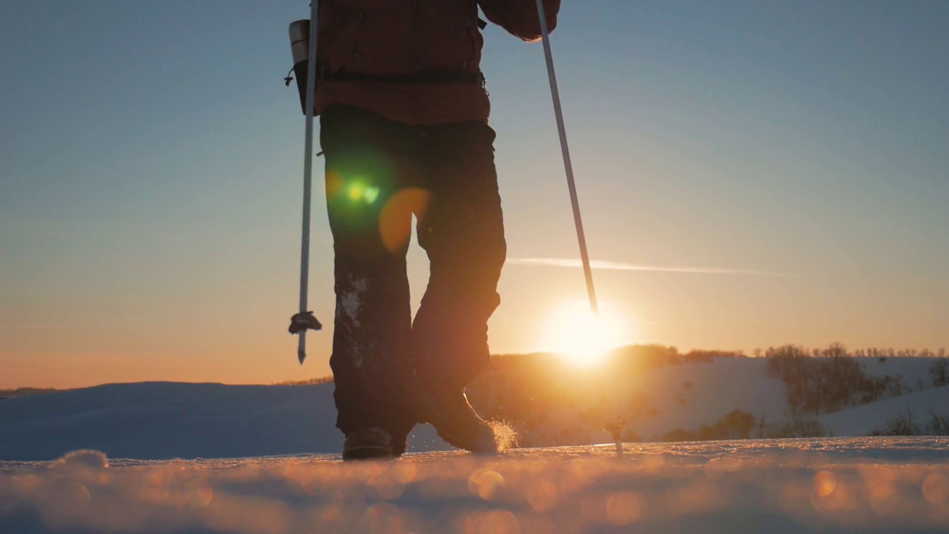 Hiker walking trekking in wintertime cold snowy weather. Legs in go ...