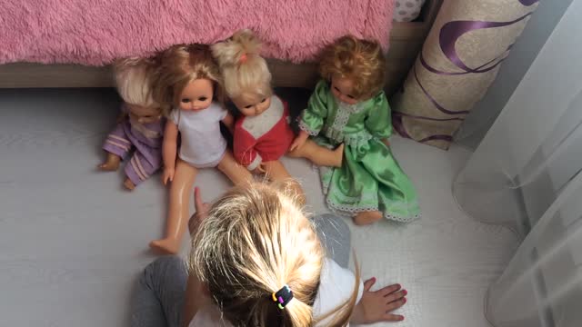 Girl Playing With Dolls Stock Footage: Royalty-Free Video Clips ...