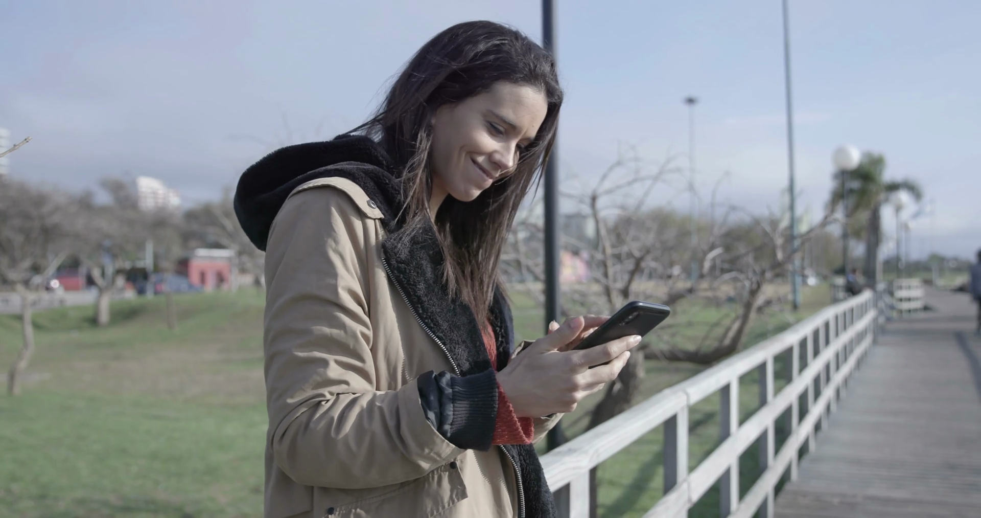 Woman Texting On Cellphone In Park Outdoors Stock Footage SBV-348591523 ...