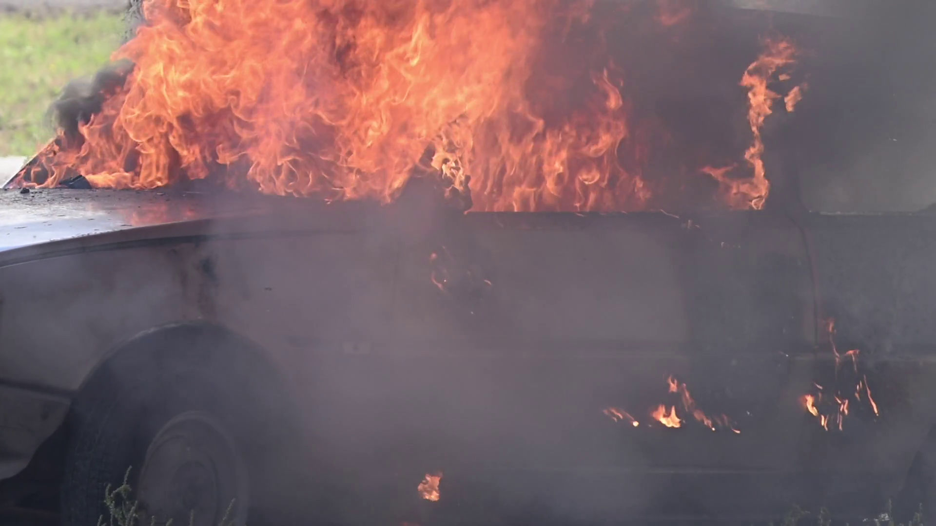 A Car Is On Fire With Flames Engulfing Stock Footage SBV-351853786 ...