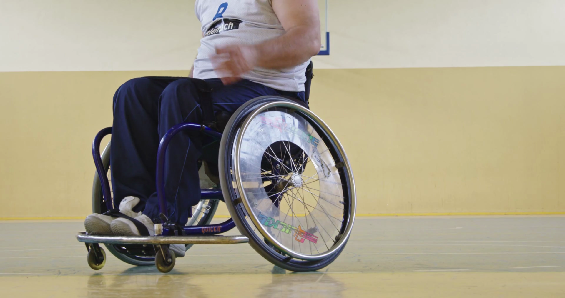 Person with a disability playing a basketball game alone in a modern ...