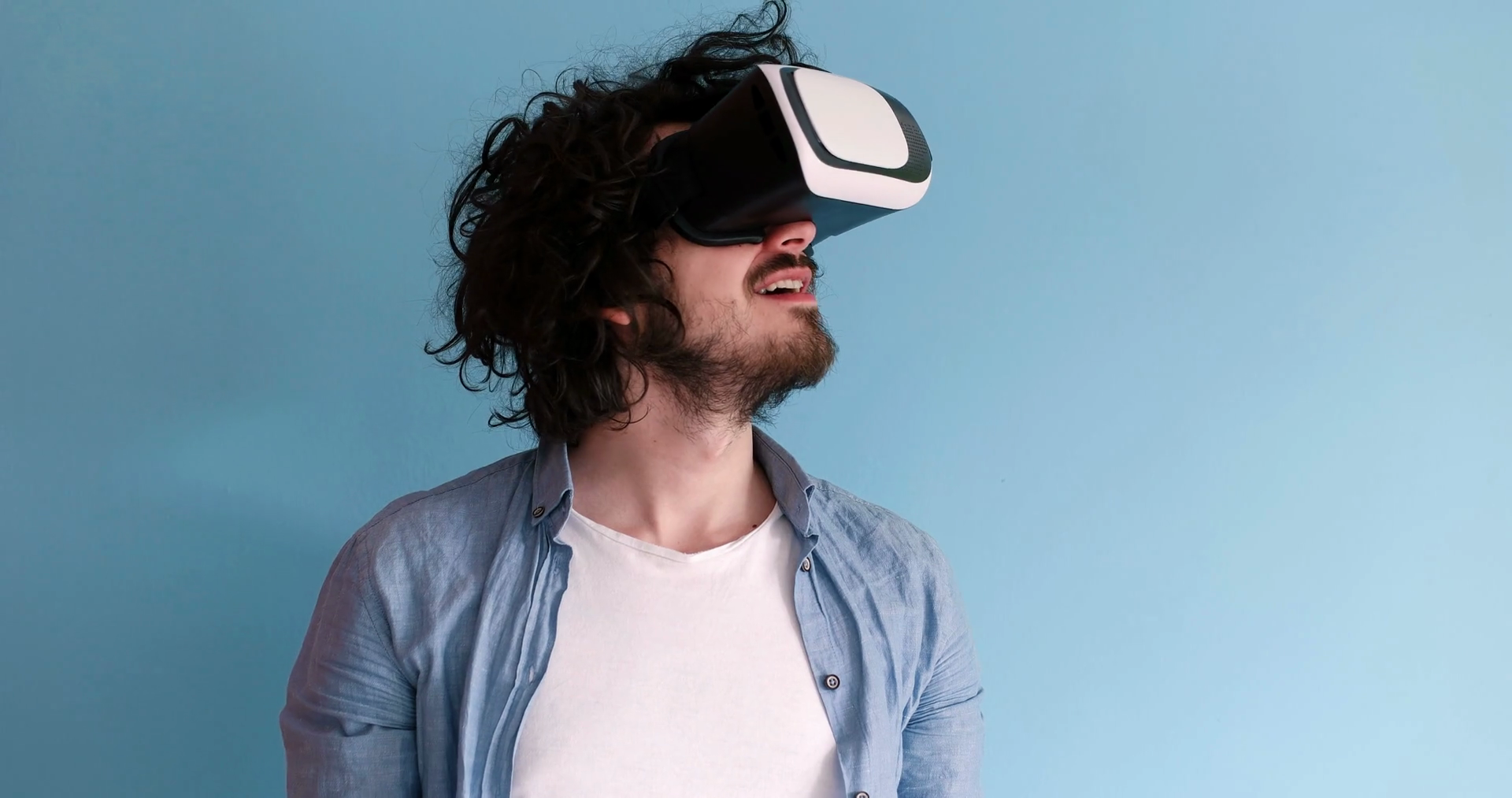 Handsome Man Experincing Virtual Reality Using Vr Headset on blue ...