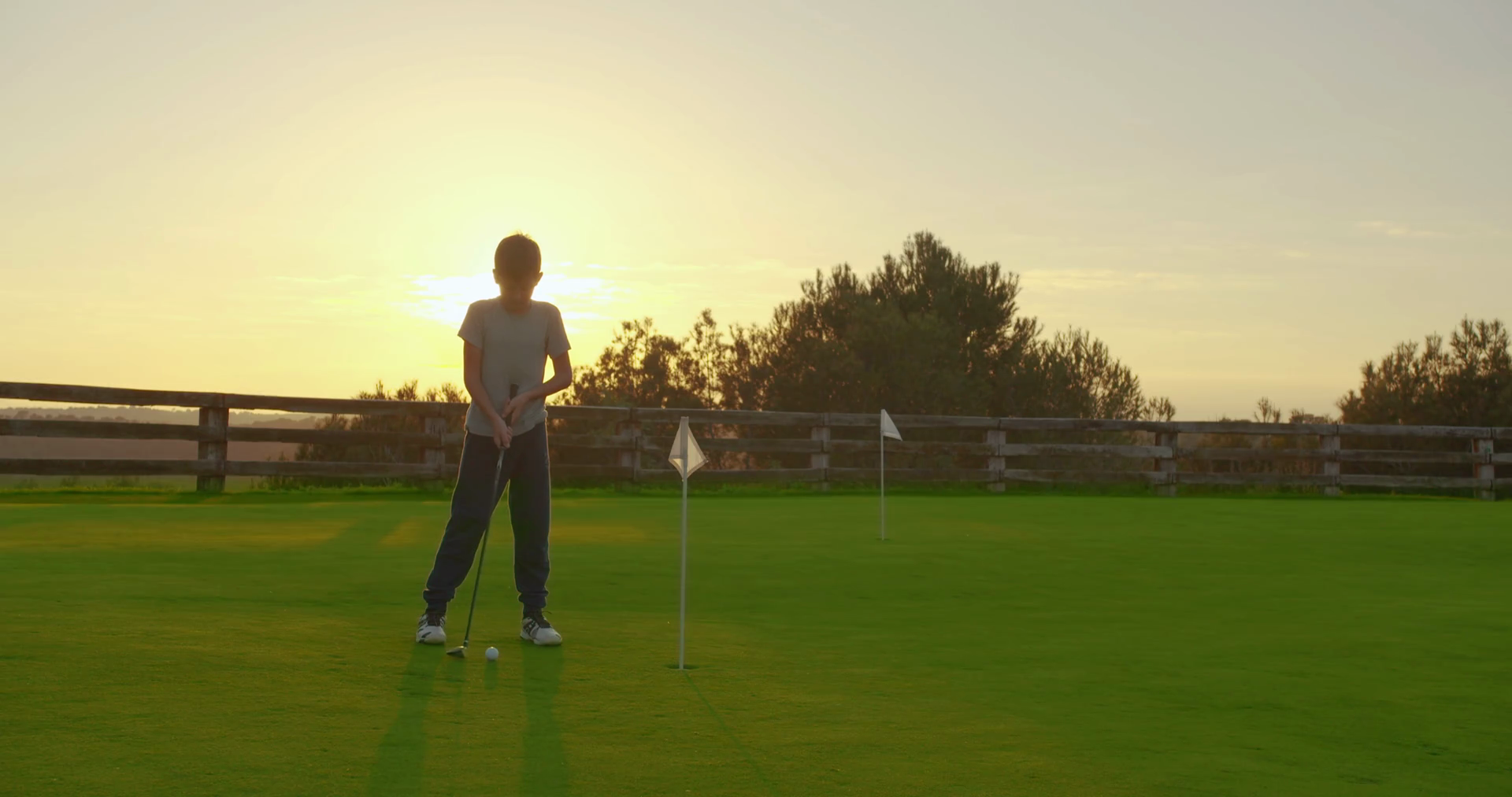 Boy playing golf with at sunset. Stock Video Footage 00:10 SBV ...