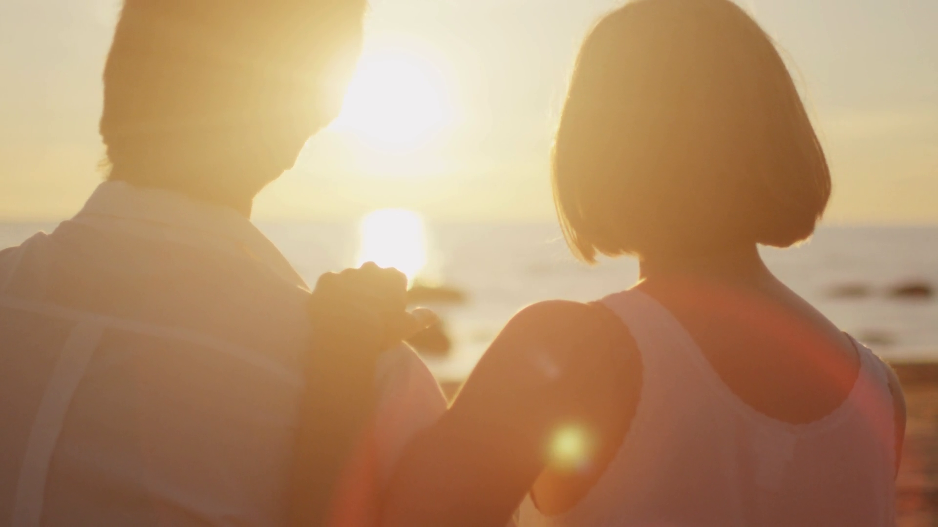 Couple Is Sitting On Beach Watching Together Stock Footage SBV-351897958 - Storyblocks