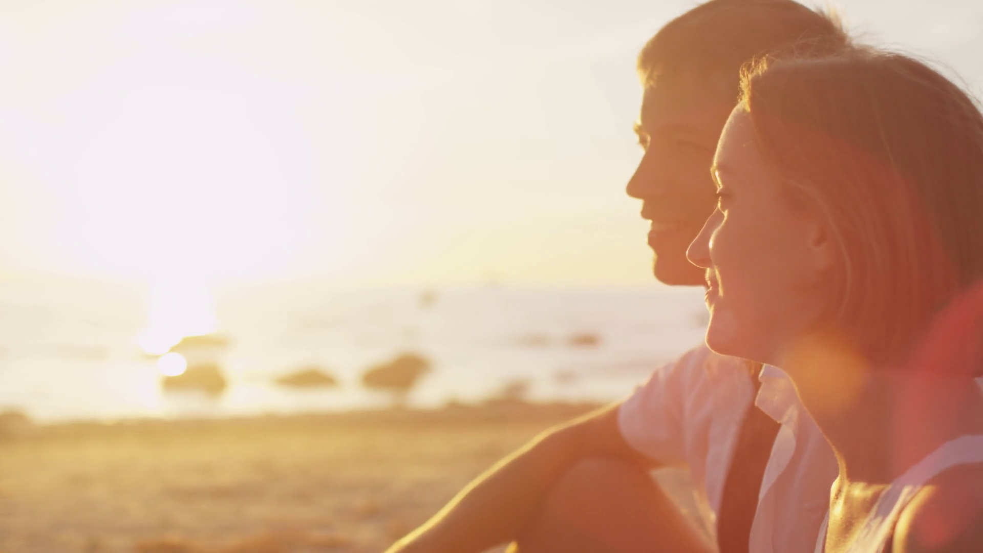 Couple Is Sitting On Beach Watching Together Stock Footage SBV-351897915 - Storyblocks