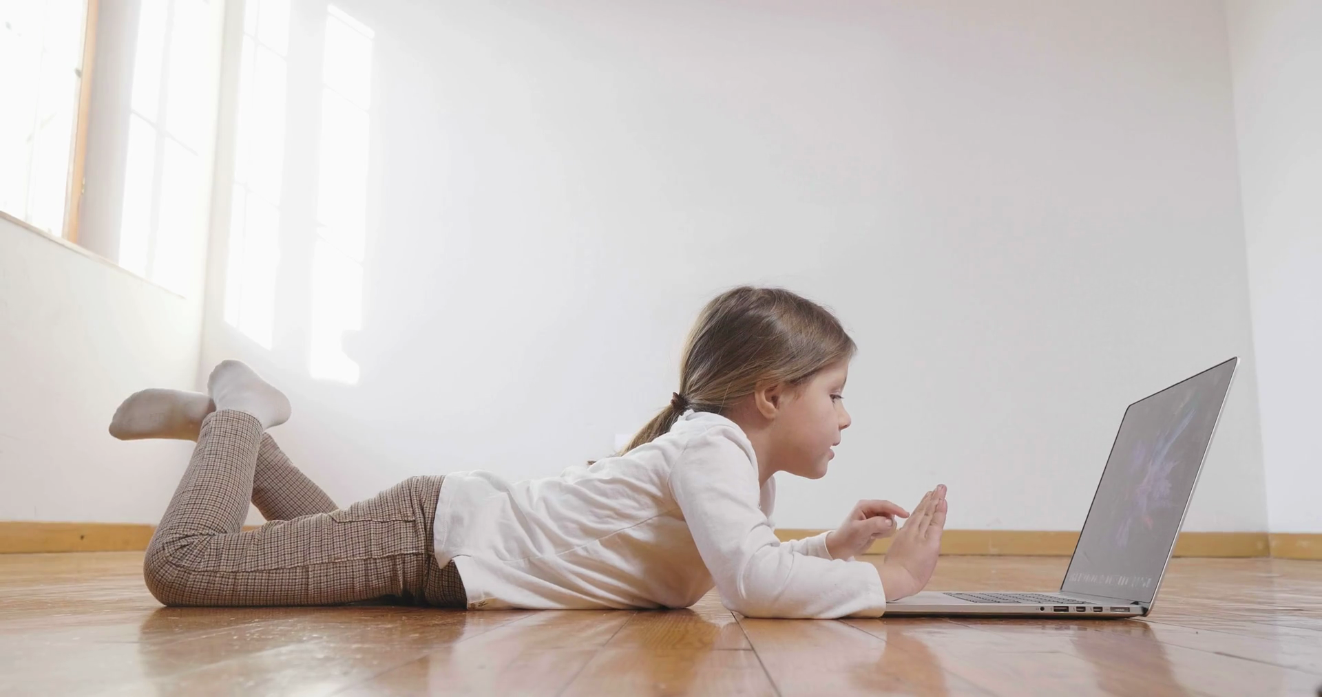A Little Girl Lying On Floor Uses Computer Stock Footage SBV-348919013 ...