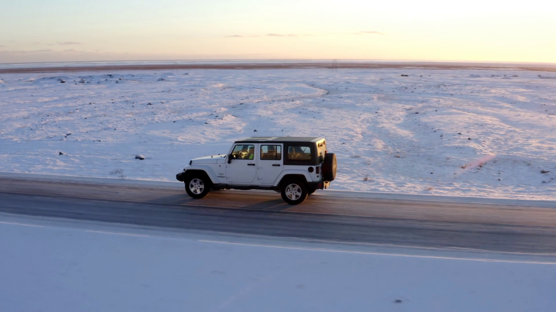 Aerial: Close Up Following Jeep From Side On Stock Footage SBV ...