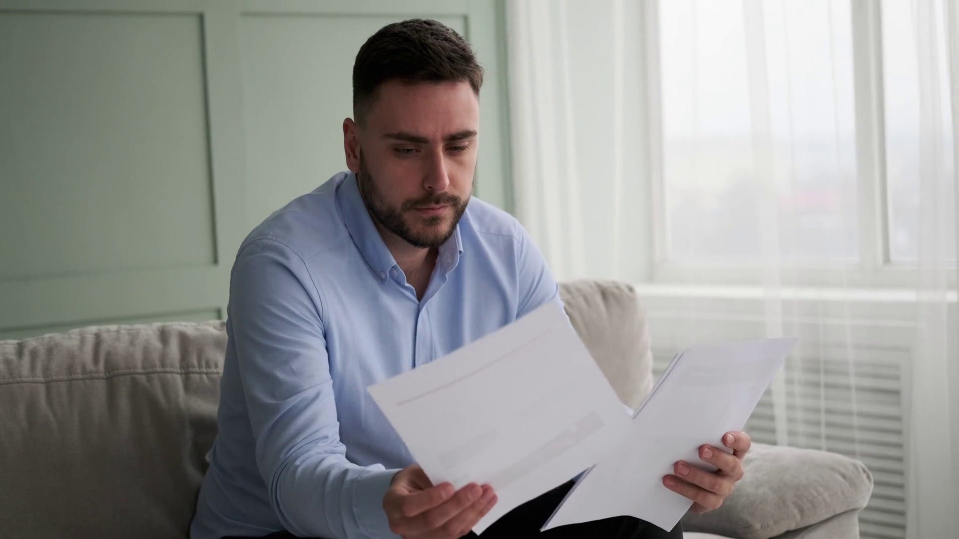 Caucasian Man Checking Documents On Sofa Stock Footage SBV-347777103 ...